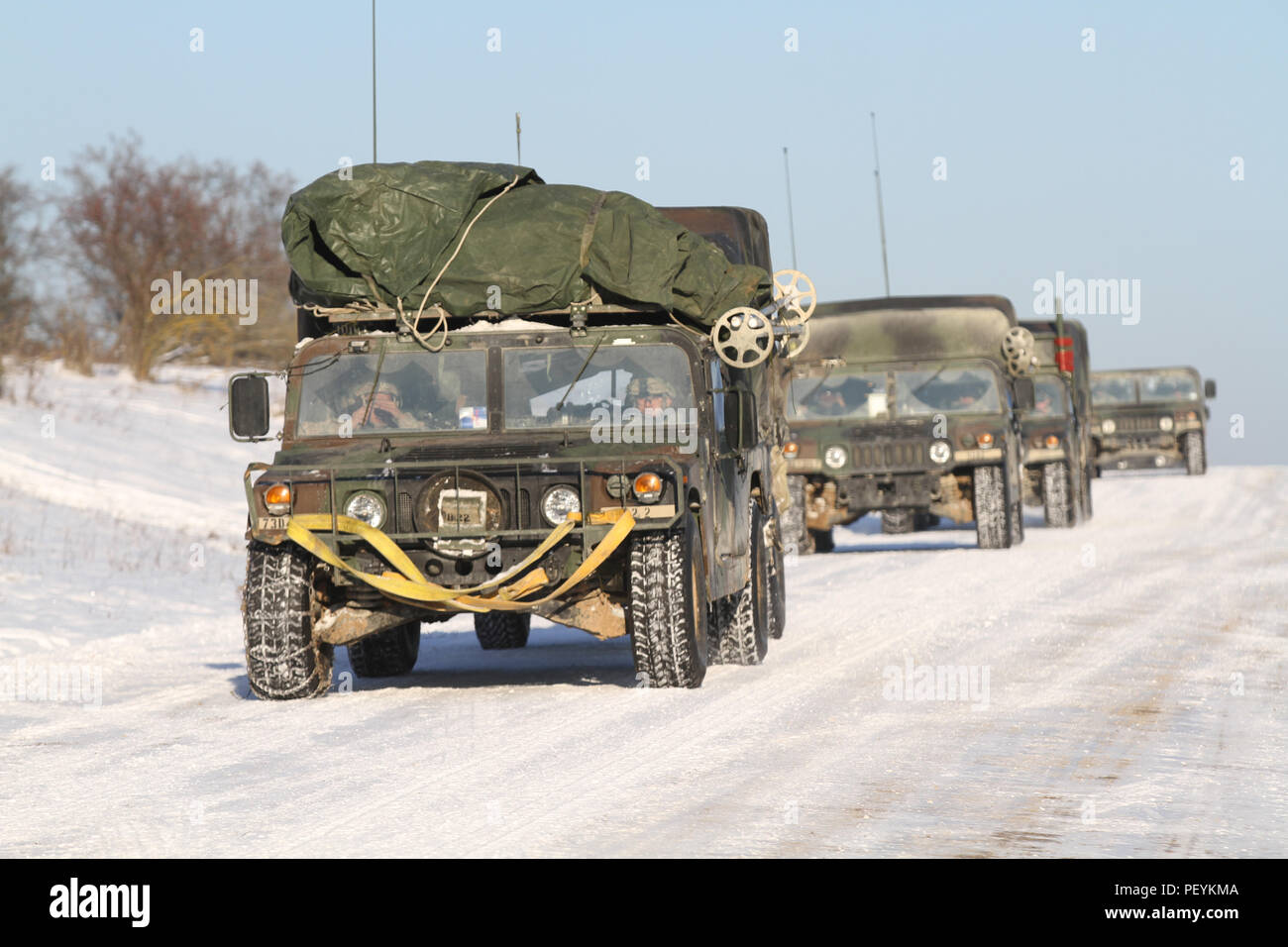 A convoy of U.S. Army vehicles moves to a simulated firing point over ...