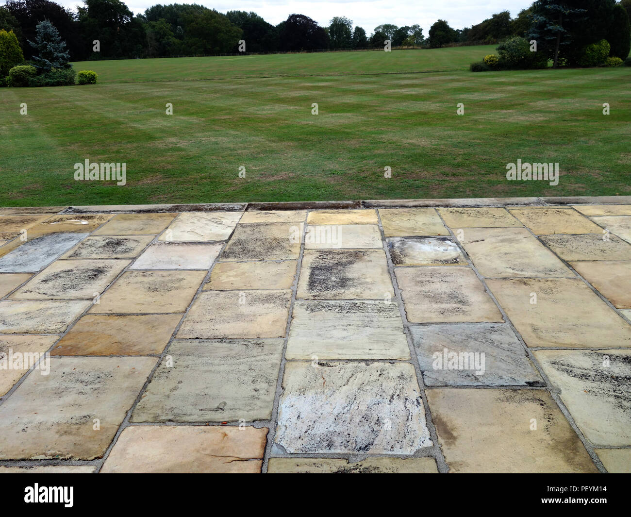Large areas wonderful old real Yorkstone slabs in paved area ...