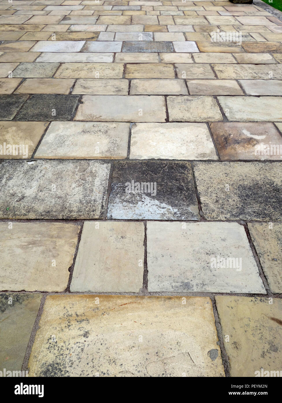 Large areas wonderful old real Yorkstone slabs in paved area around a ...