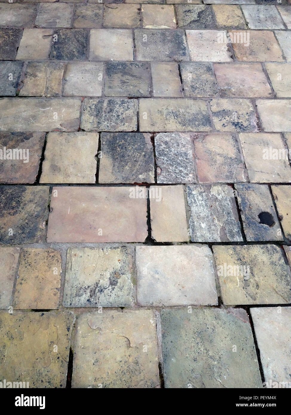 Large areas wonderful old real Yorkstone slabs in paved area around a ...