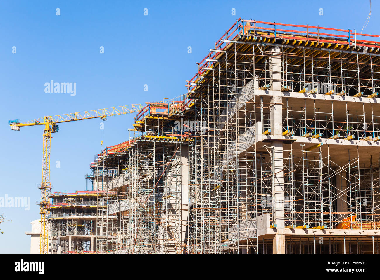 Construction building activity closeup scaffolding floor supports to ...