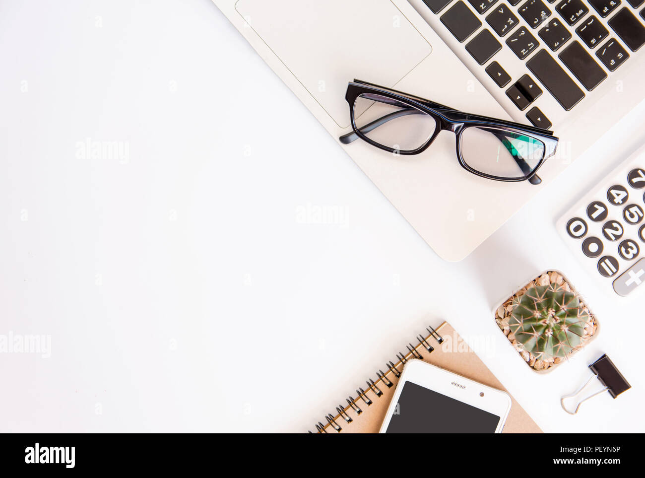 White office desk table, workspace office with laptop, smartphone black ...