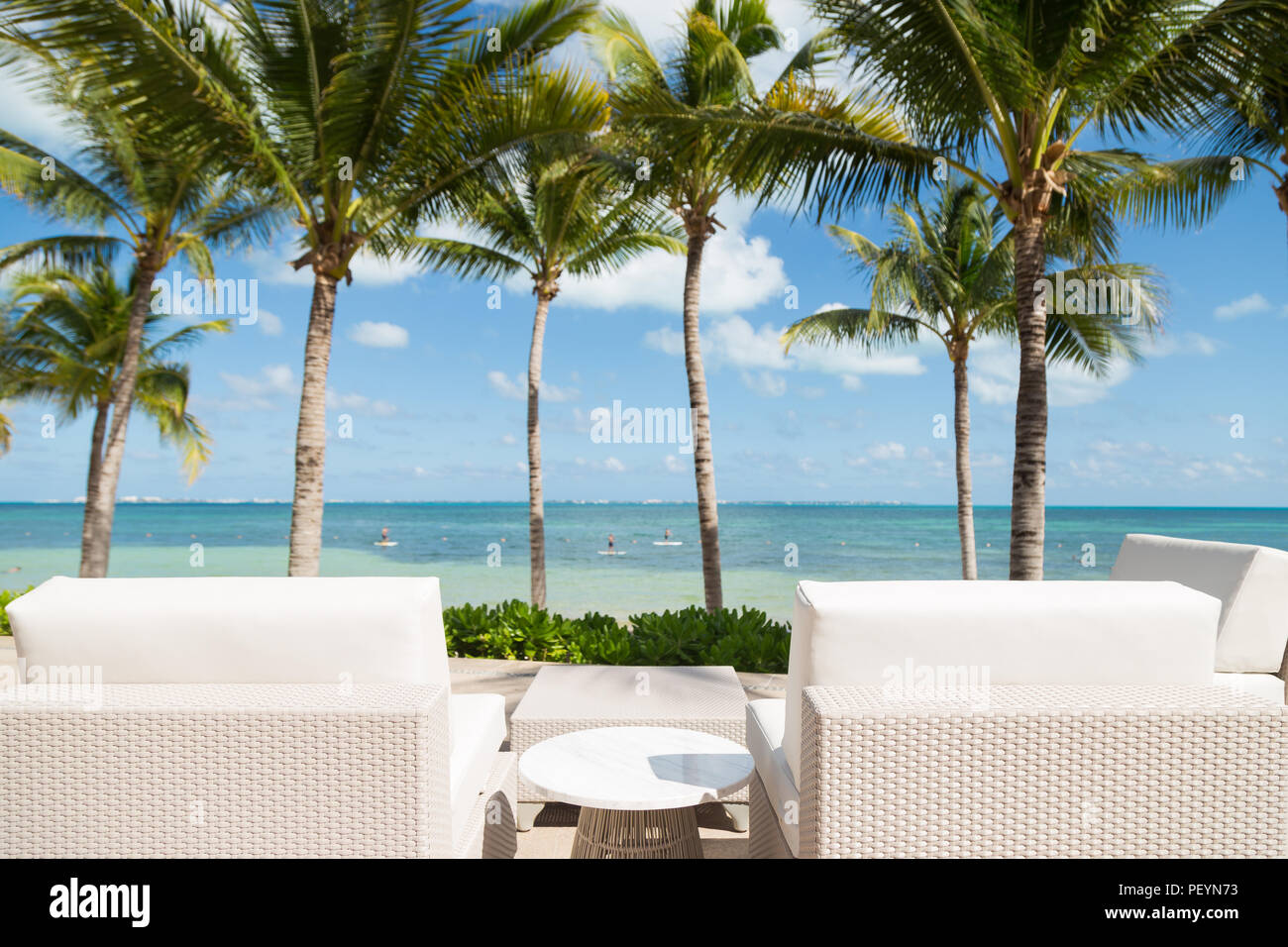 Lounge chairs with a view overlooking a tropical beach Stock Photo - Alamy