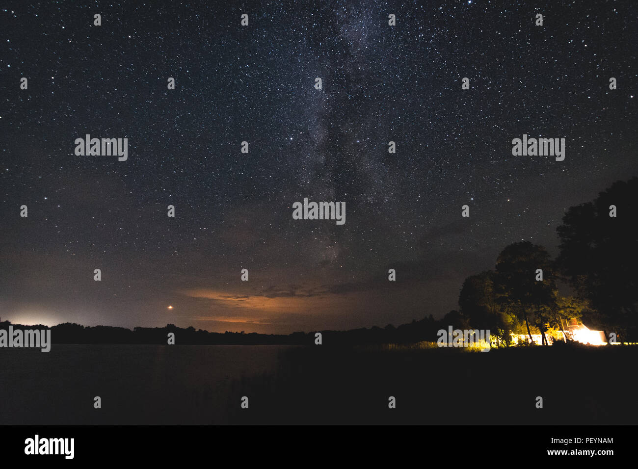 Night shooting stars photography by lake Stock Photo - Alamy