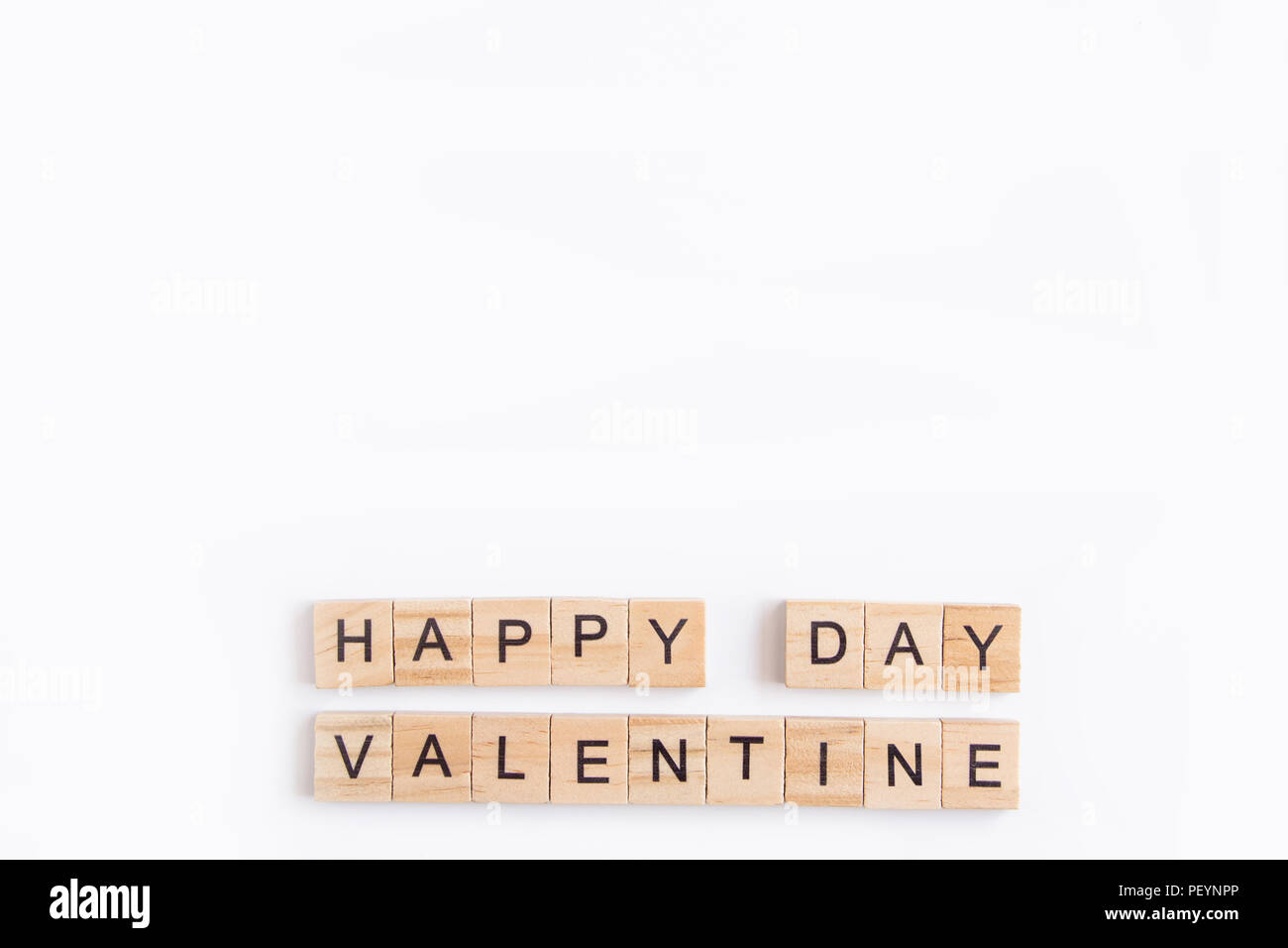 Alphabet letter wooden blocks tiles Valentine`s day on white background ...