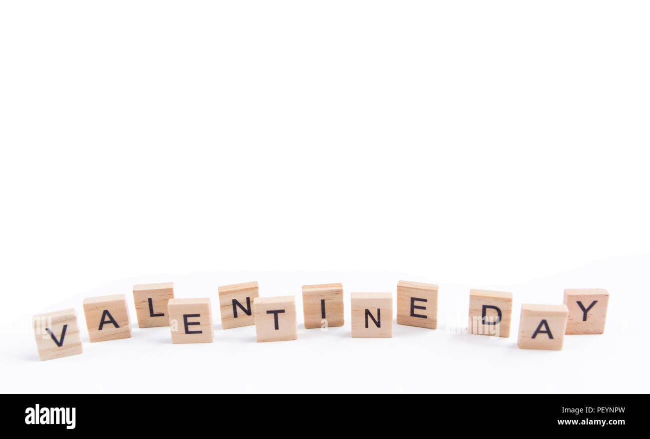 Alphabet letter wooden blocks tiles Valentine`s day on white background ...