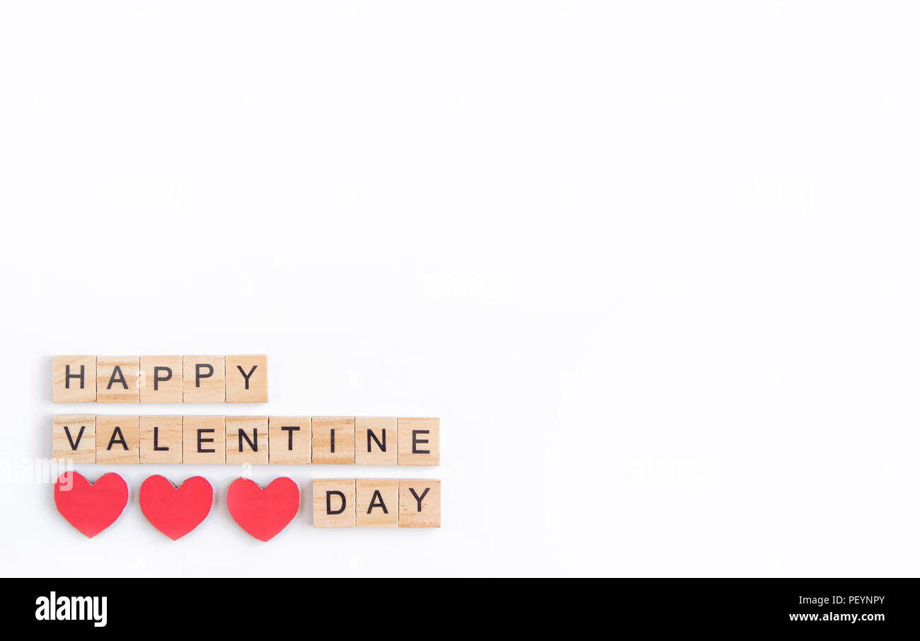 Alphabet letter wooden blocks tiles Valentine`s day on white background ...