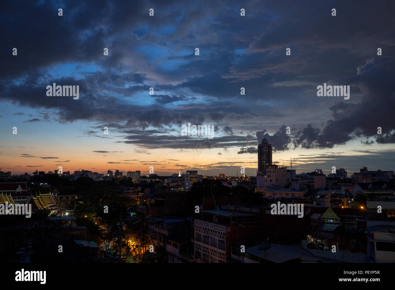 a big asia city by night to the sunrise with all the lights on the ...