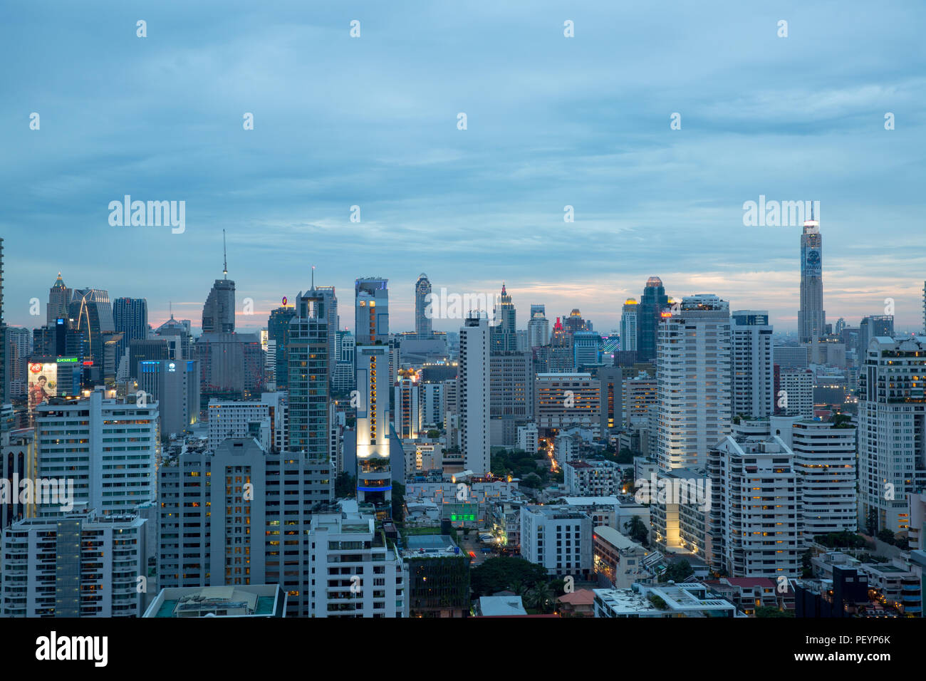 a city in asia with traffic and a river between skyscrapers Stock Photo ...