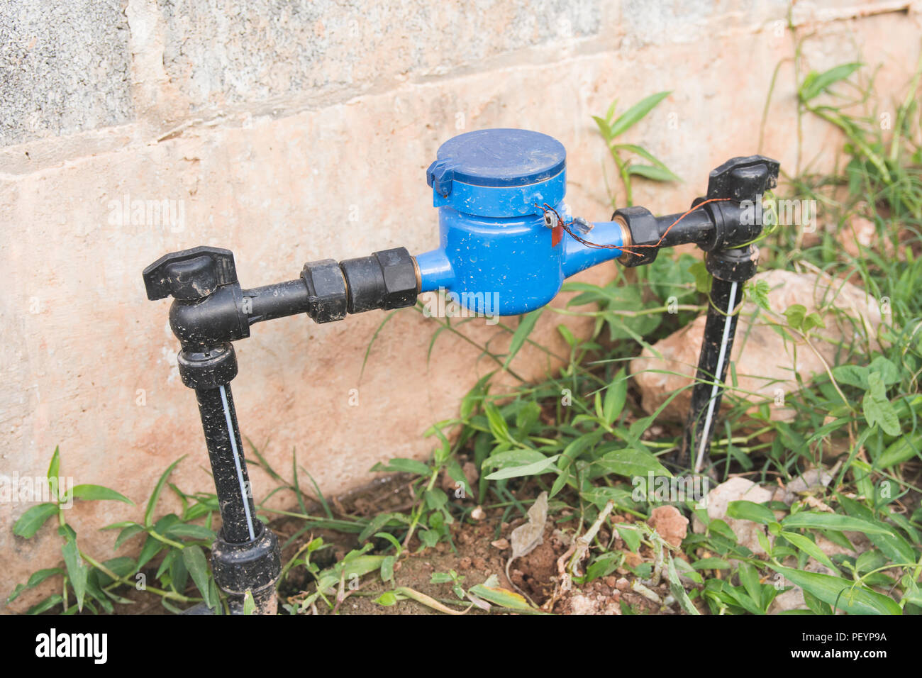 Water Meter blue with black water Pipe Stock Photo - Alamy