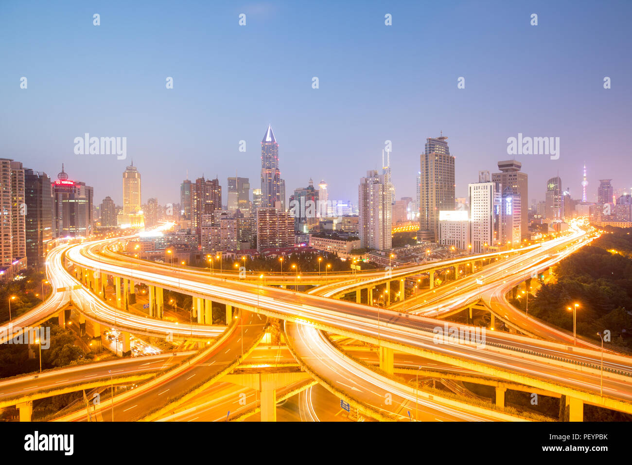 a big asia city by night to the sunrise with all the lights on the ...