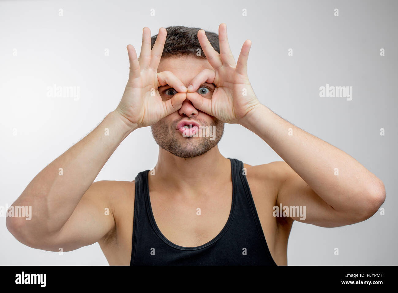 Fingers around eyes hi-res stock photography and images - Alamy