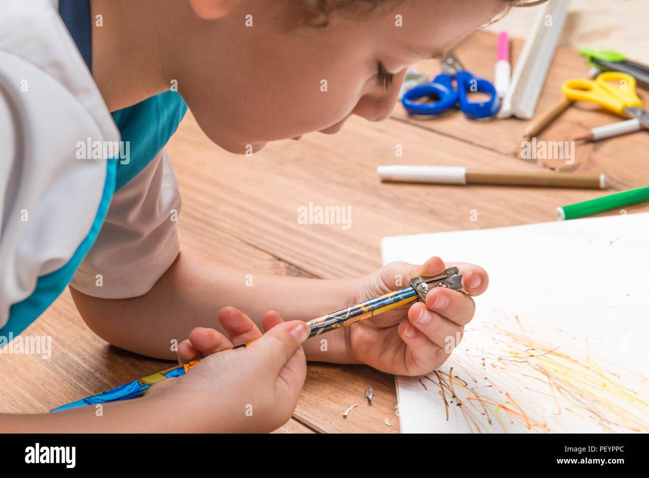 Elementary student sharpening pencil hi-res stock photography and ...