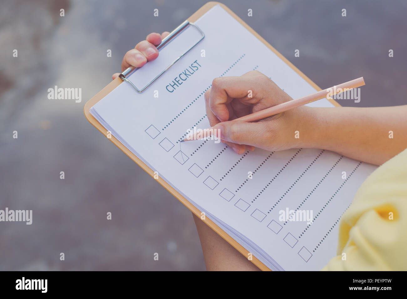 business female preparing checklist at office desk Stock Photo - Alamy