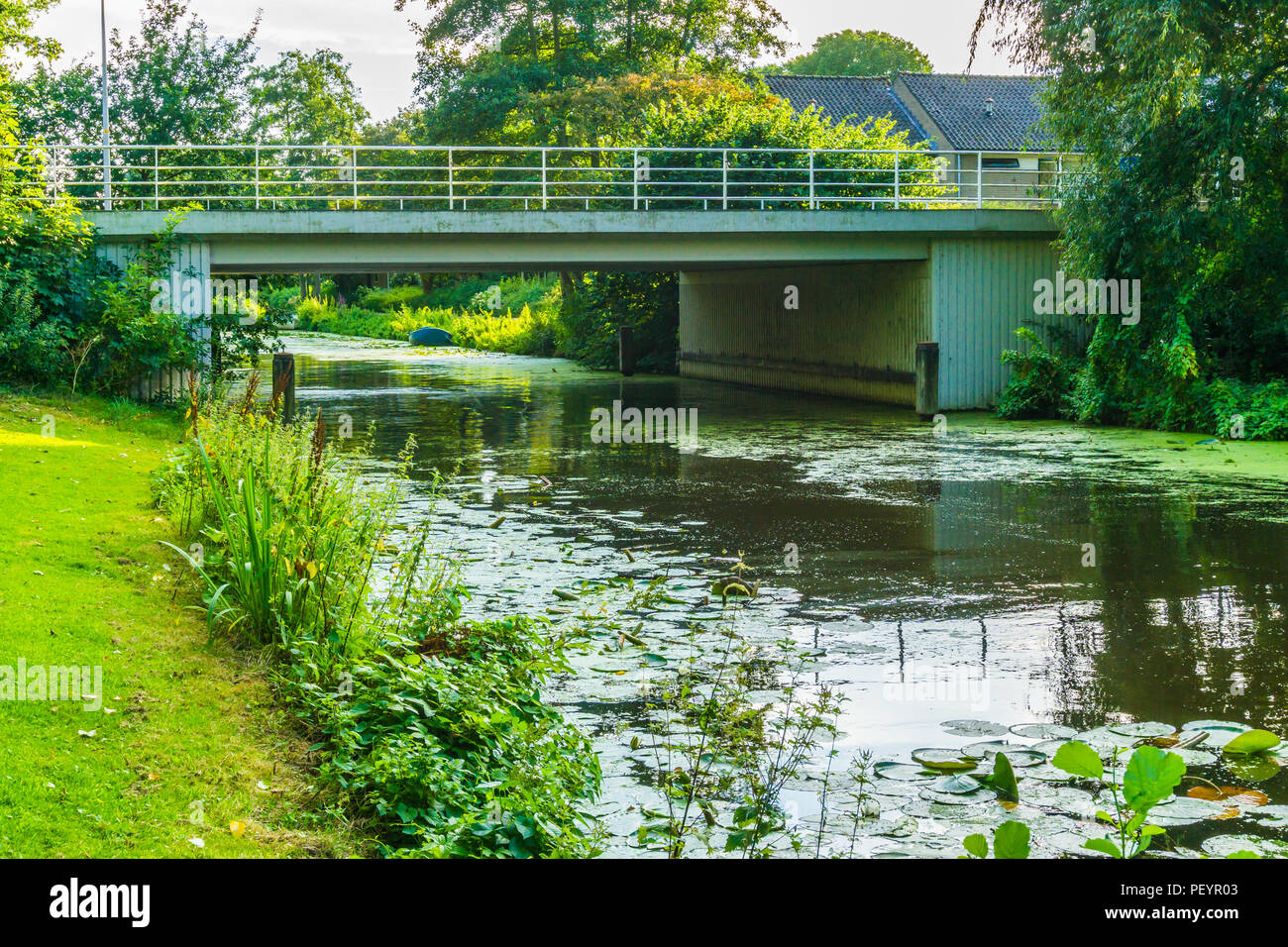stone bridge to cross over the river in a water landscape Stock Photo ...