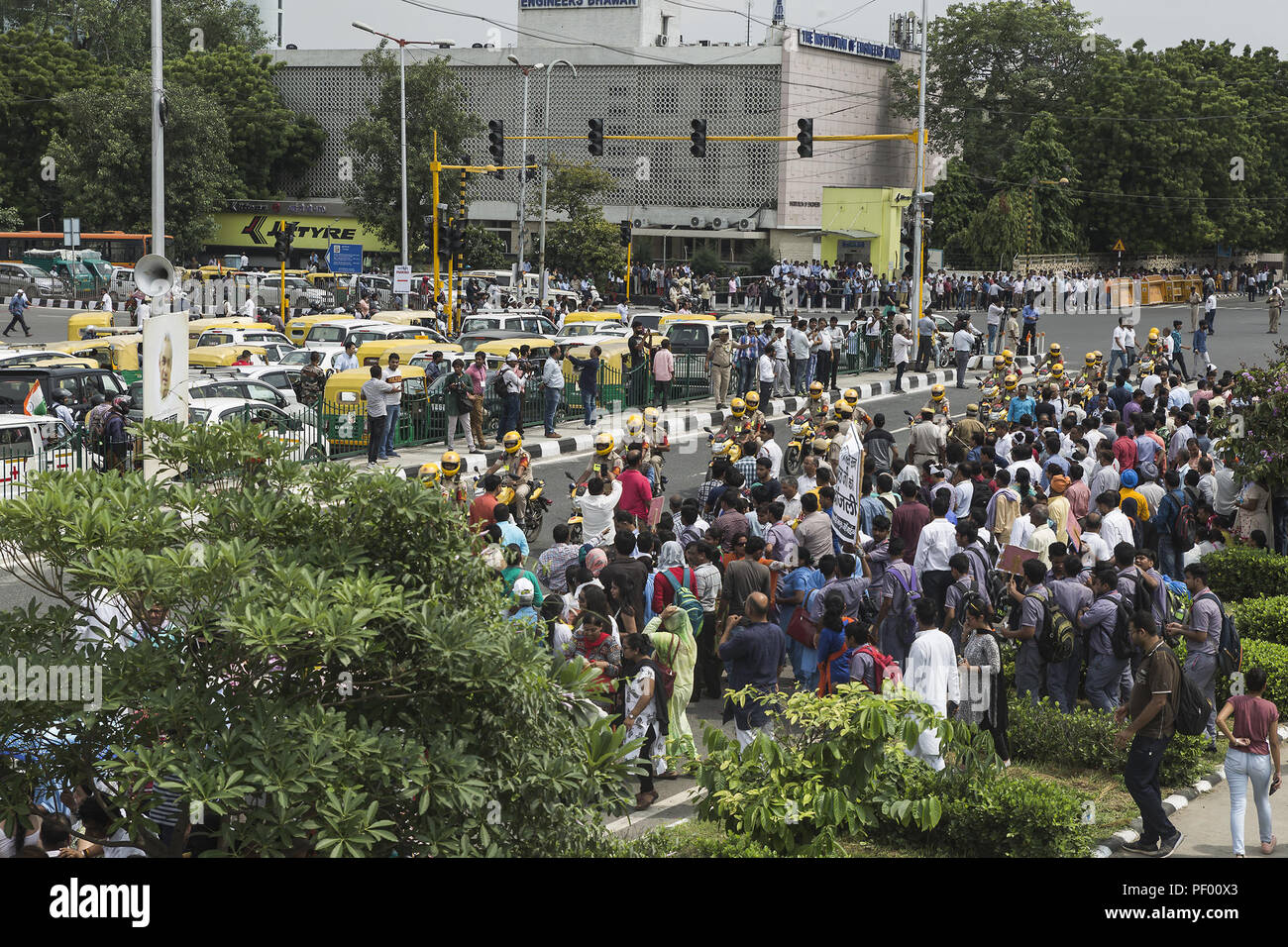 New Delhi, India. 17th July 2018. Security personal taking a ride while ...