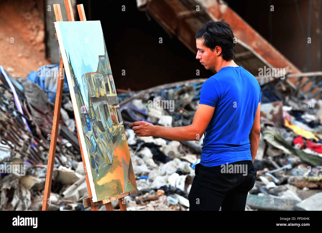 Damascus, Syria. 16th Aug, 2018. A Syrian artist draws a painting amid ...