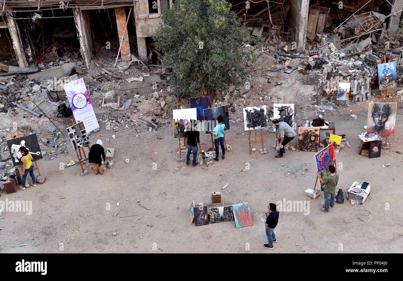 Damascus, Syria. 16th Aug, 2018. Syrian artists draw paintings amid the ...