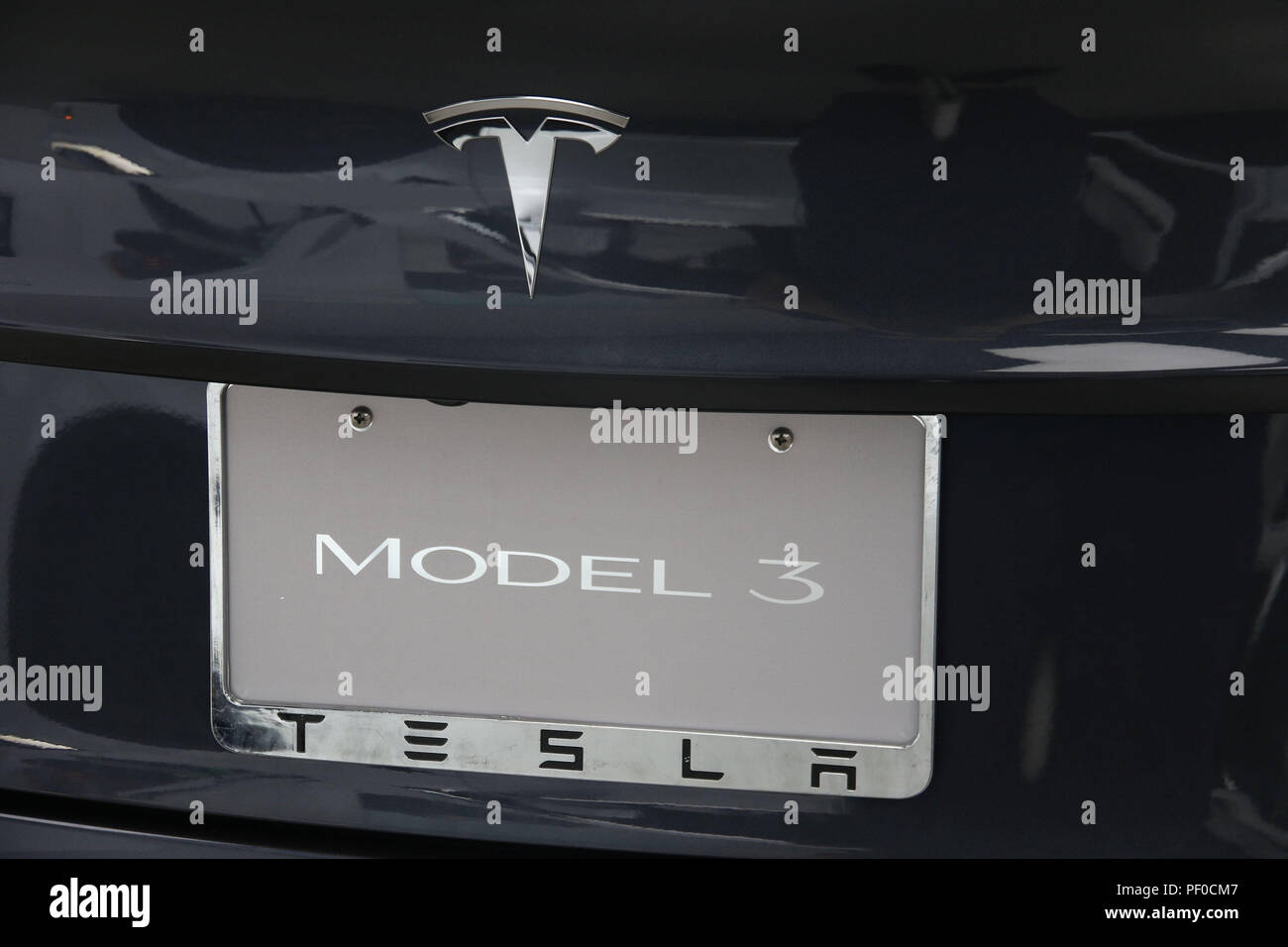 New York City, New York, USA. 17th Aug, 2018. Tesla logo with 'Model 3 ...