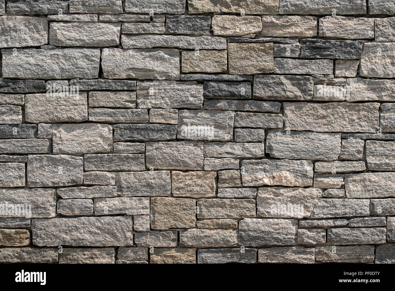 Background shot of organic square block wall Stock Photo - Alamy