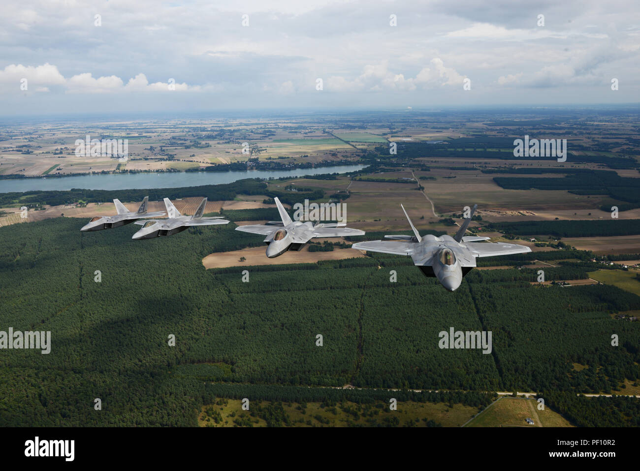Four F-22 Raptors from the 95th Fighter Squadron, 325th Fighter Wing ...