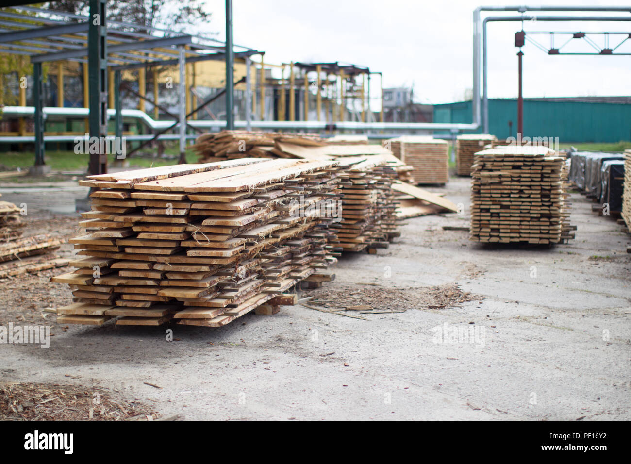 Woodworking industry. A pile of untreated wooden boards.Wood in ...