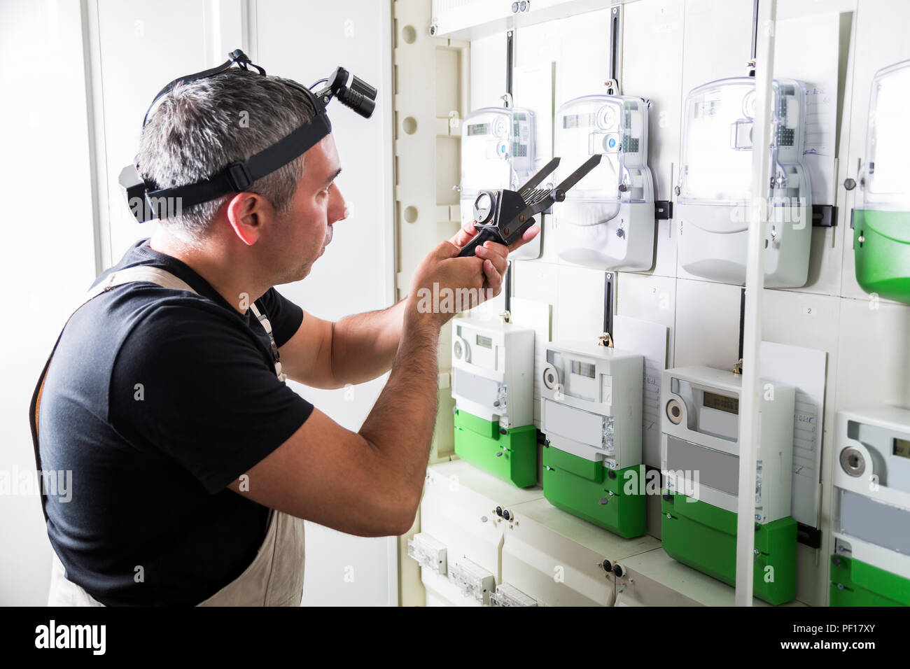 Electrician testing equipment in fuse switch box close up Stock Photo ...