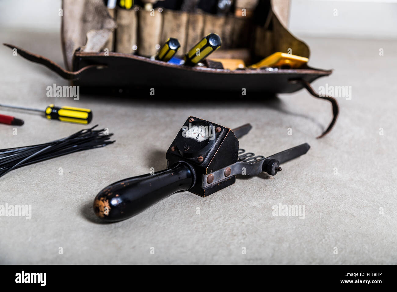 Box with electrician tools on leather background Stock Photo - Alamy
