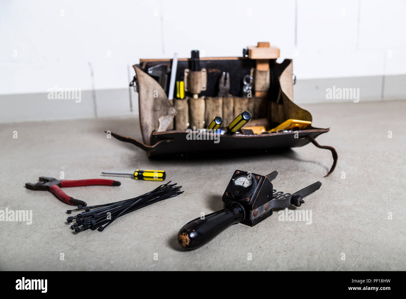 Box with electrician tools on leather background Stock Photo - Alamy