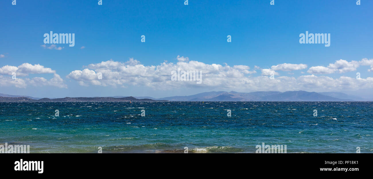 Windy beach and stormy sea, blue sky with clouds background Stock Photo ...
