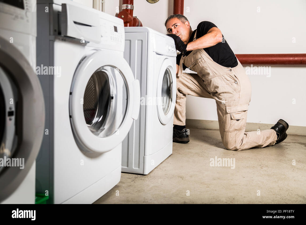 Fixing interior washing machine hi-res stock photography and images - Alamy
