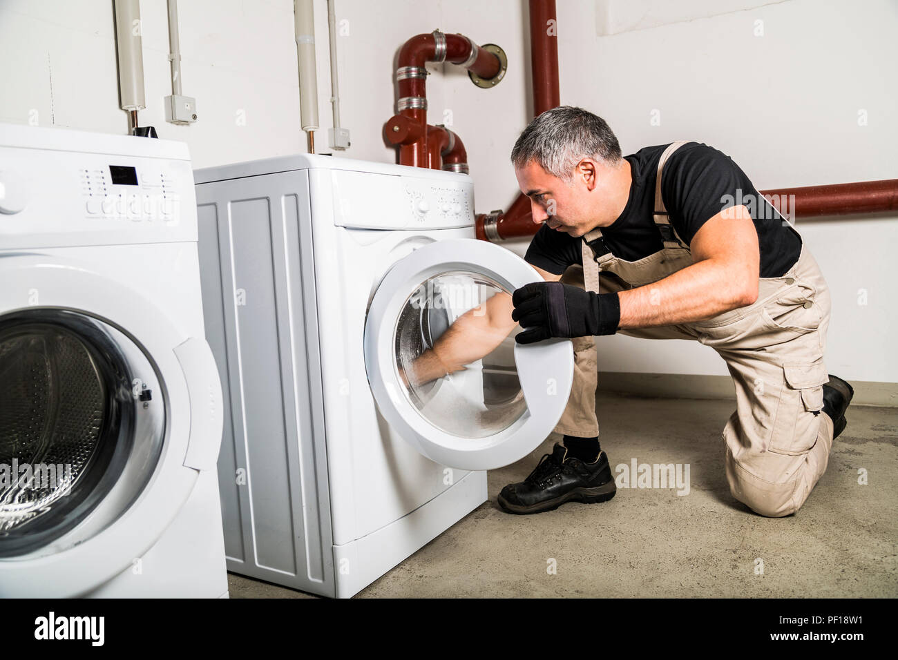 Fixing drum washing machine hi-res stock photography and images - Alamy