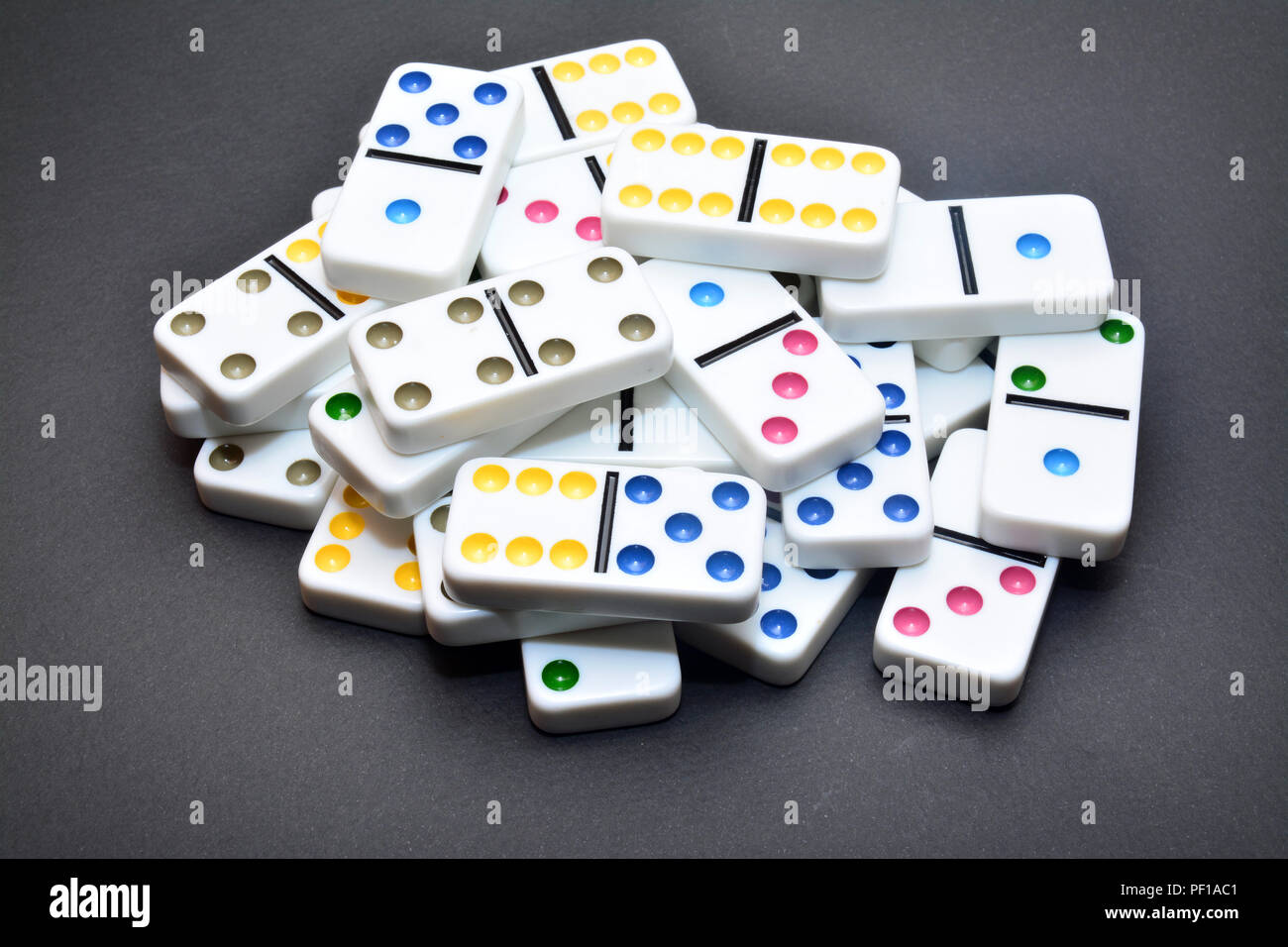 dominoes blocks over a grey background Stock Photo - Alamy