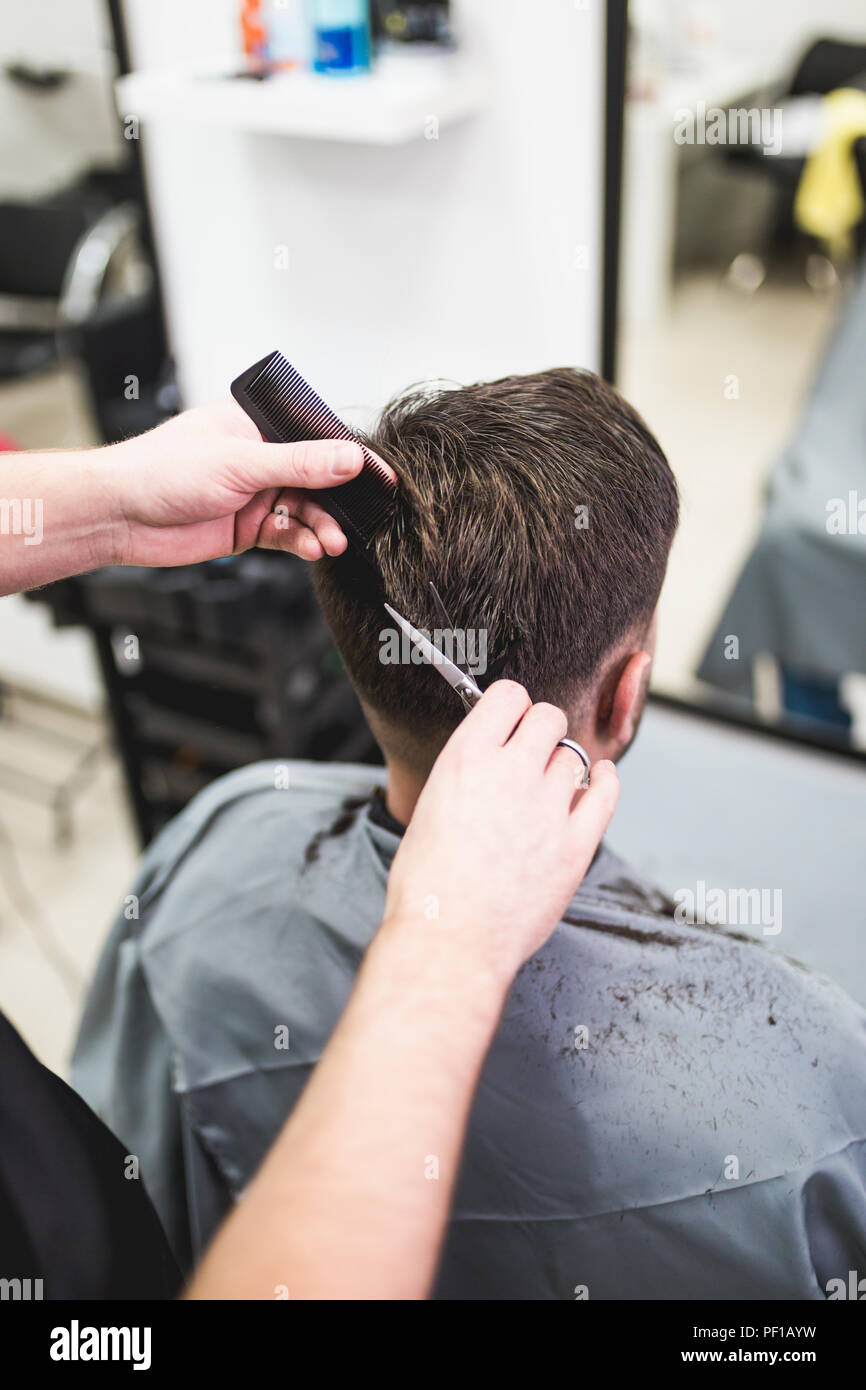 Male client getting haircut hairdresser hi-res stock photography and ...