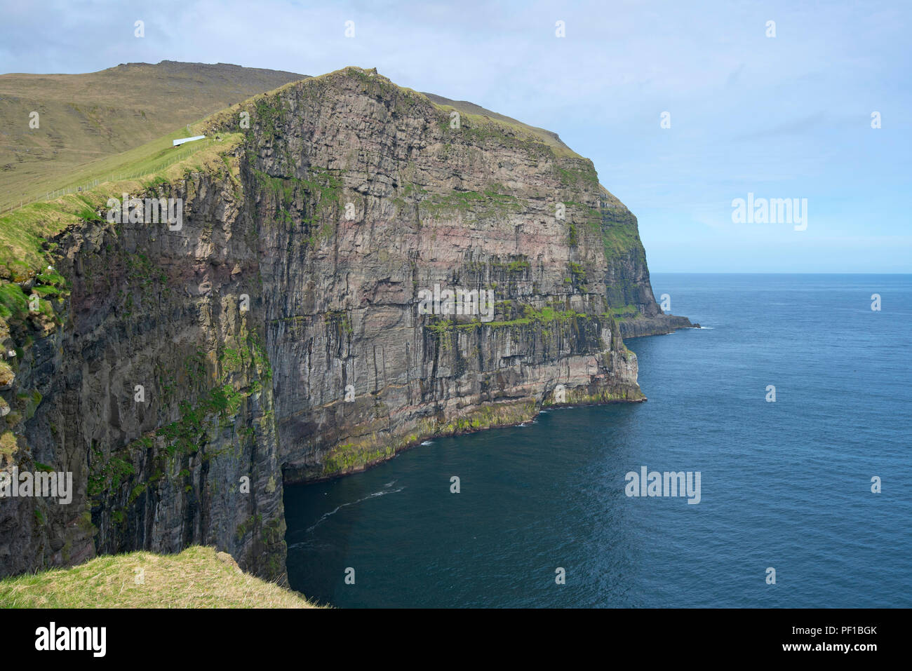 Steep cliff near the village of Gjogv on the island of Eysturoy, Faroe ...