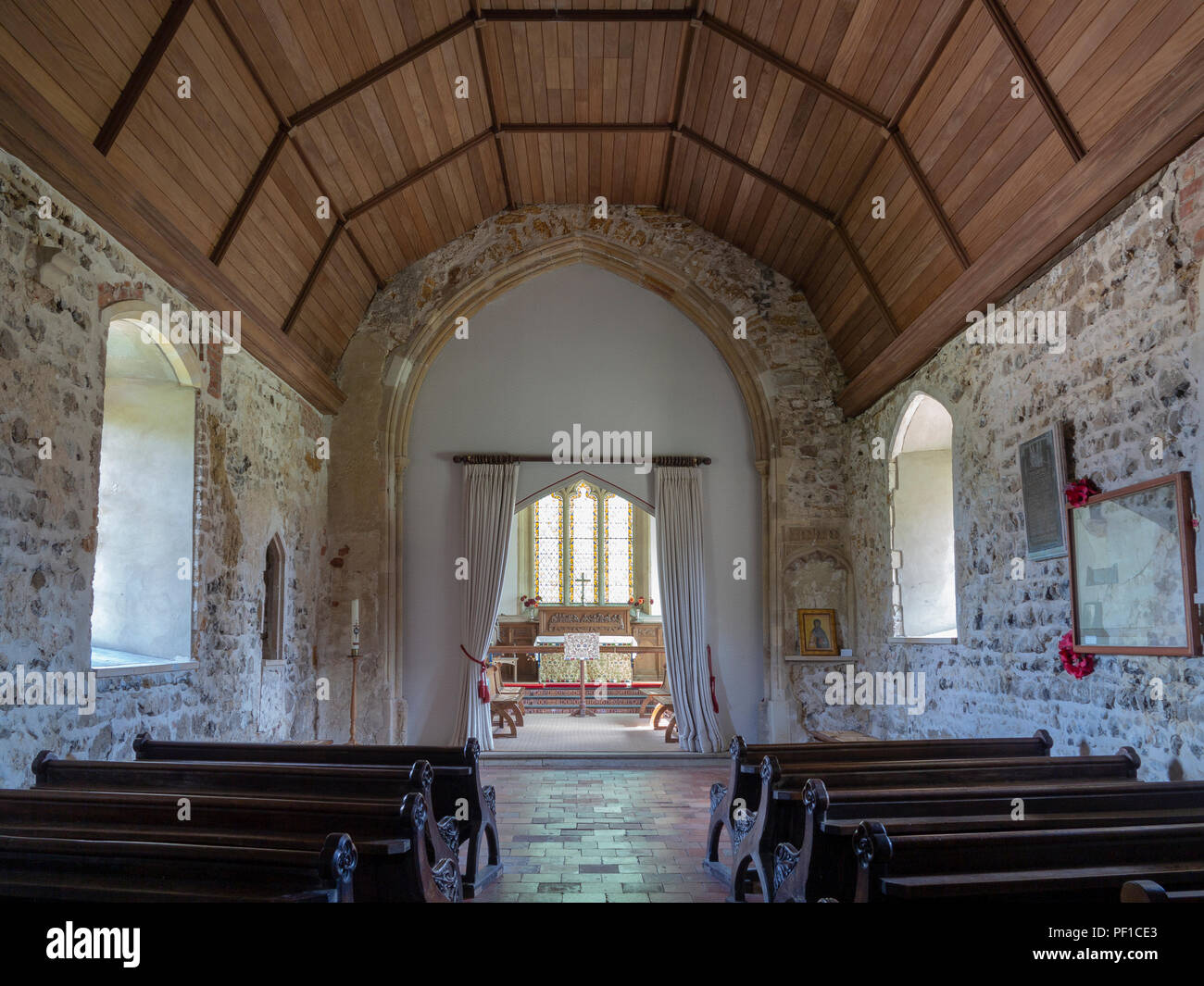 Interior of St Botolph's Church Iken Suffolk, looking down aisle ...