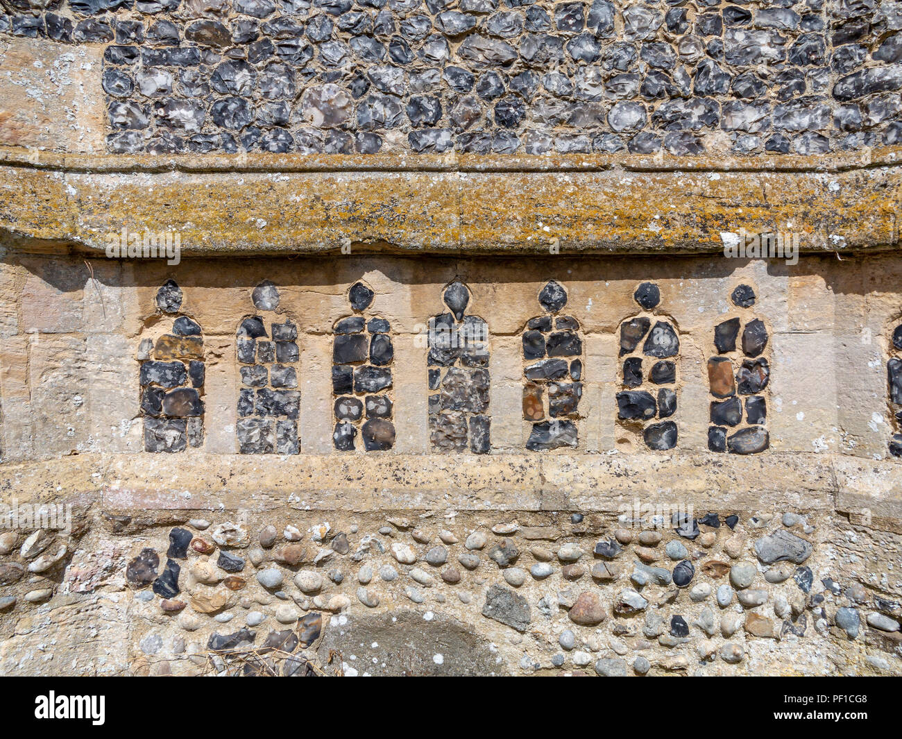 Details of knapped flint and stone church walls Stock Photo - Alamy