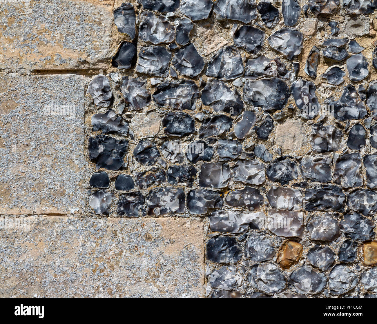 Details of knapped flint and stone church walls Stock Photo - Alamy