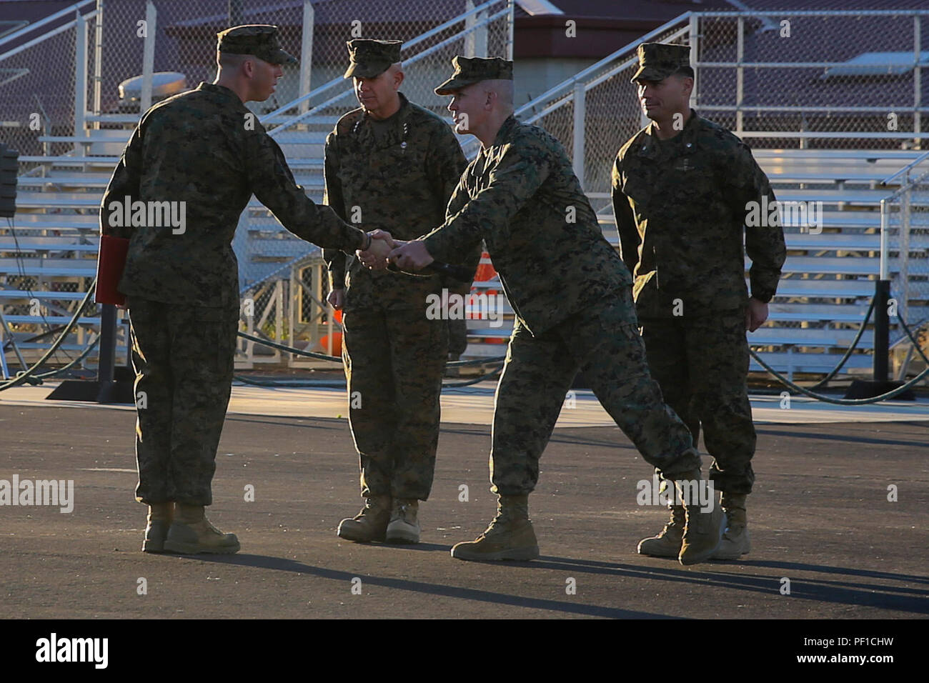 Sgt. Roberto J. Perez, left, is congratulated by Sgt. Maj. Bradley ...