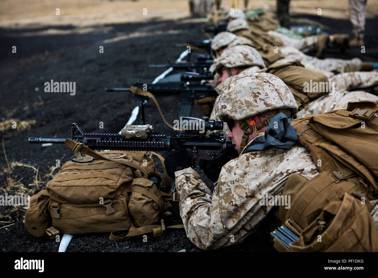 U.S. Marine Corps Cpl. Russell Ward, squad leader, shoots an M16A4 ...
