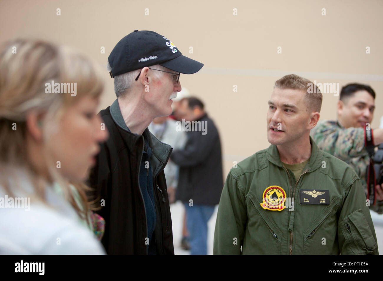 Guests from the Iwo Jima Veterans Committee speak to a U.S. Marine from ...
