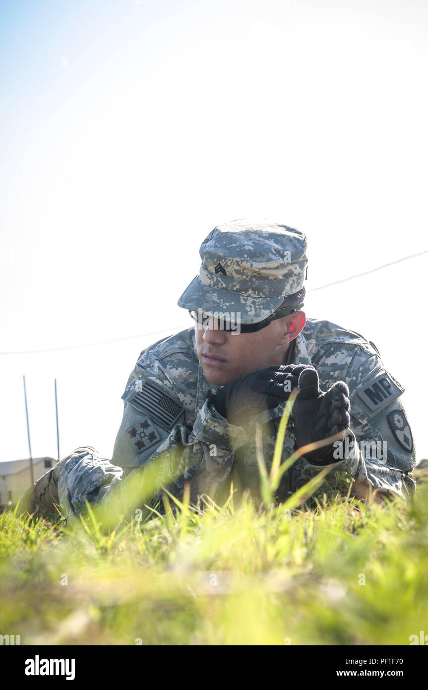 An MP pulls security while others check on the casualty during the ...