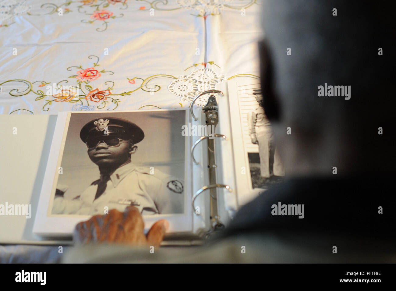 Retired Maj. George Boyd, looks at a photo of himself in service dress ...