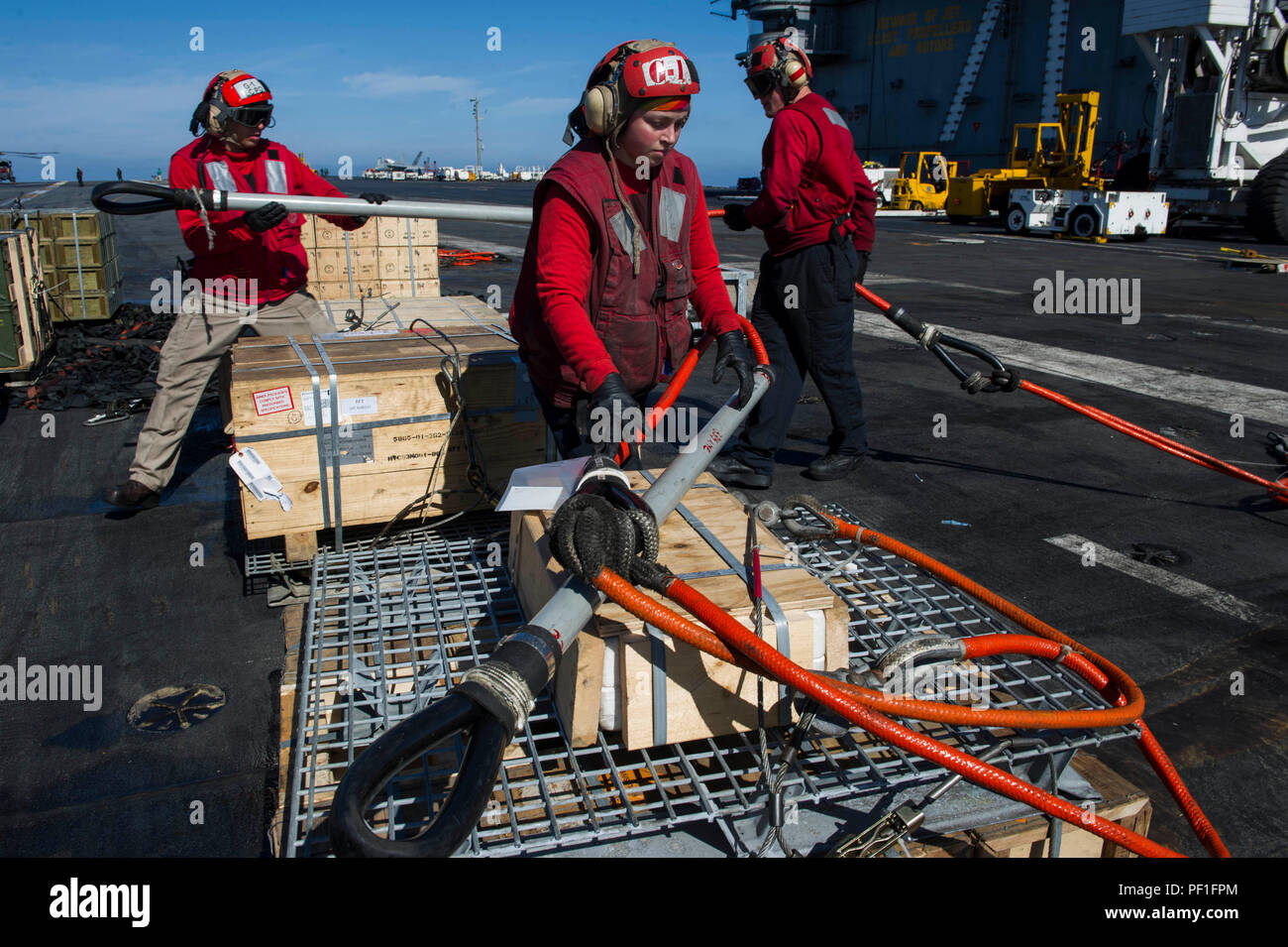 160226-N-WO968-160 PACIFIC OCEAN (Feb. 26, 2016) – Sailors hook slings ...