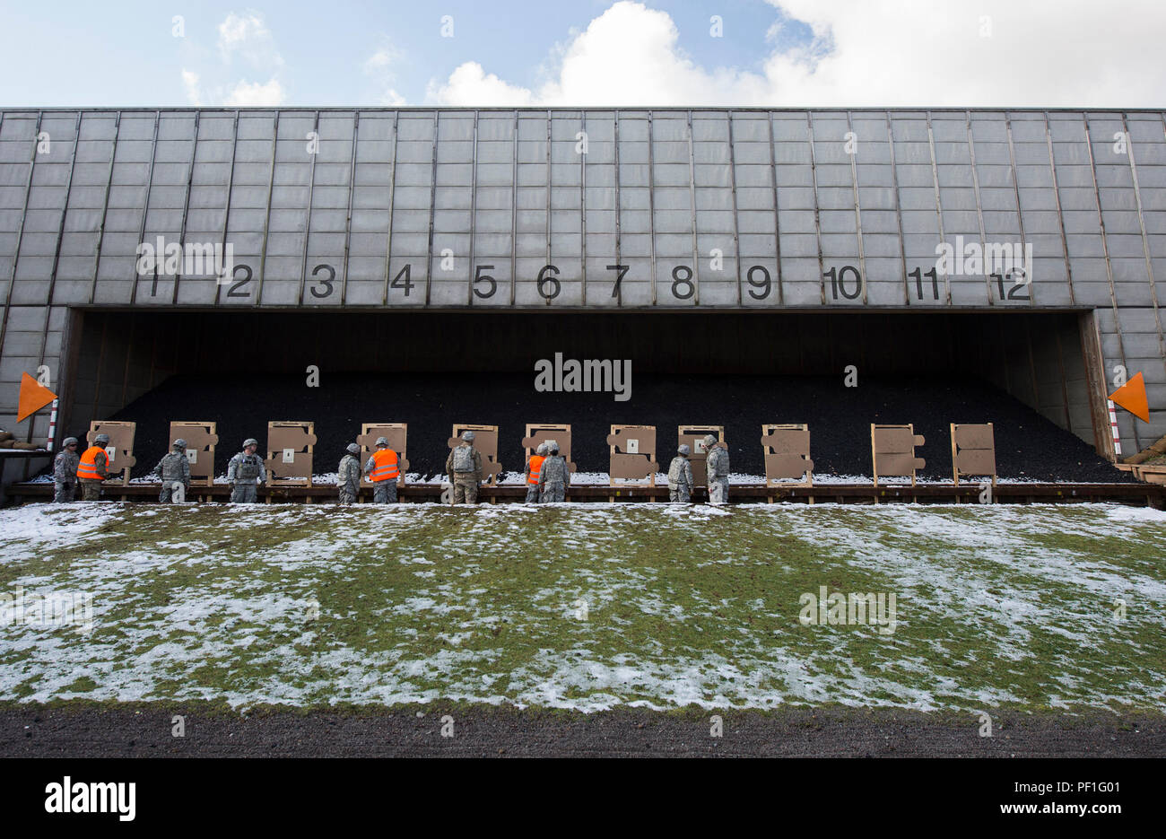 U.S. Army Soldiers check their targets after firing their M16 and M4 ...