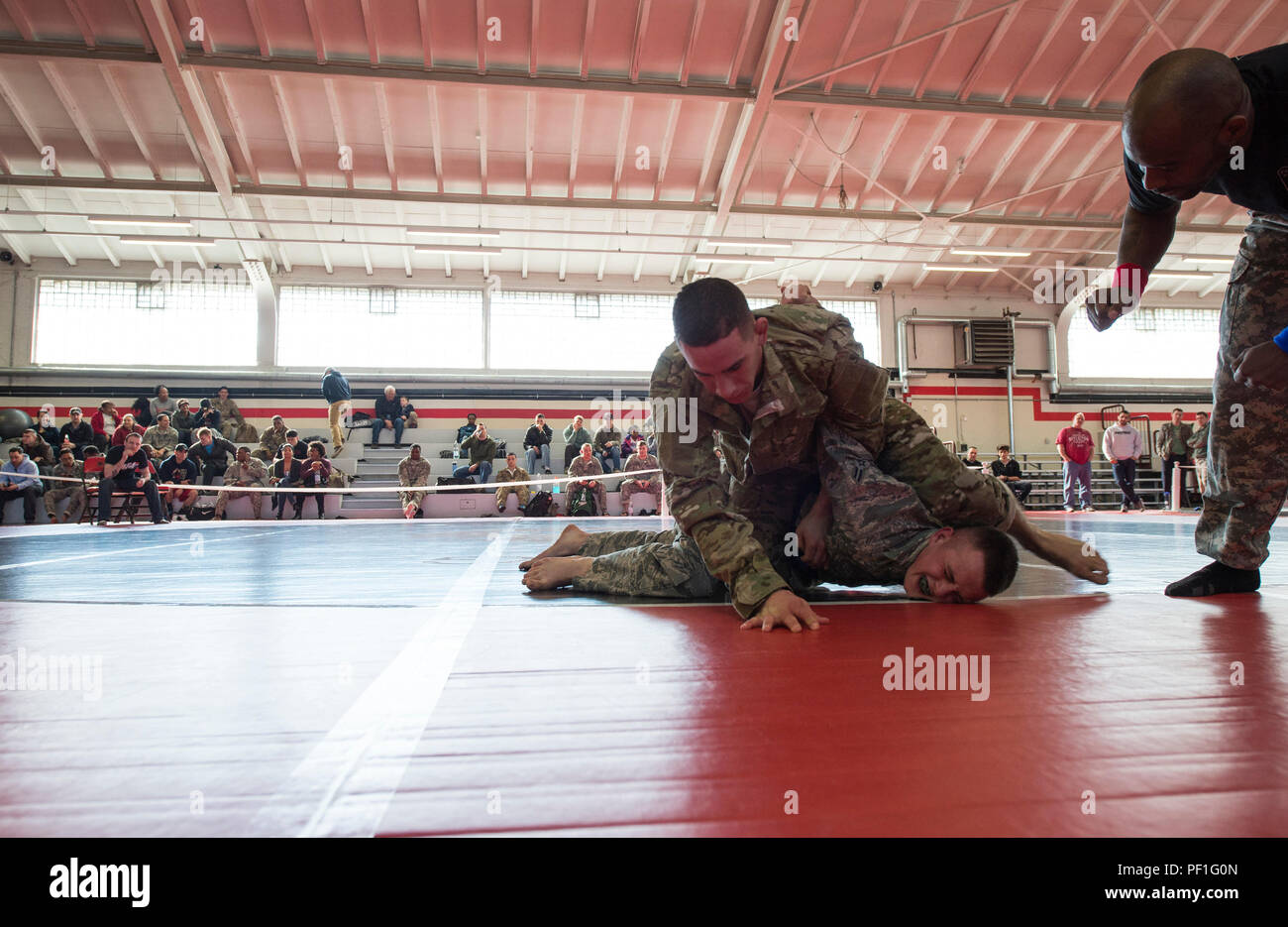 An audience watches as U.S. Air Force Senior Airman Anthony Henson (top ...