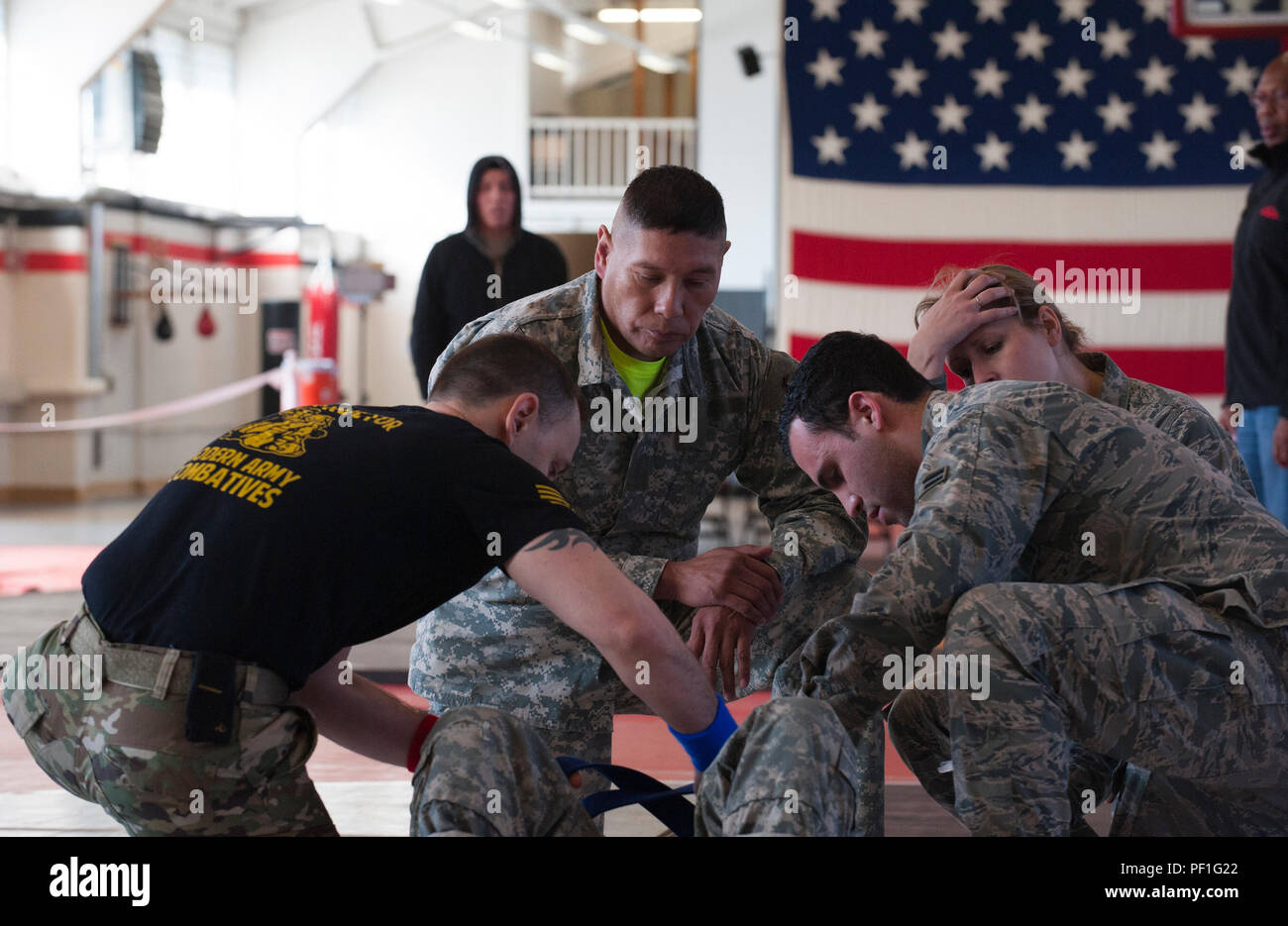 U.S. military medical personnel respond to an injured soldier during ...