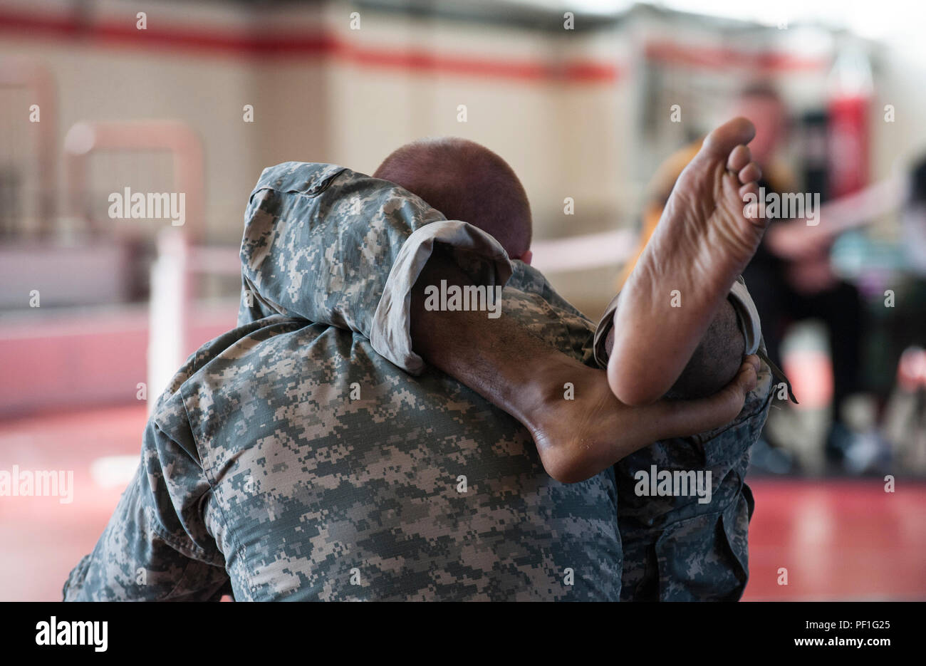 A competitor attempts a triangle choke on an opponent during the U.S ...