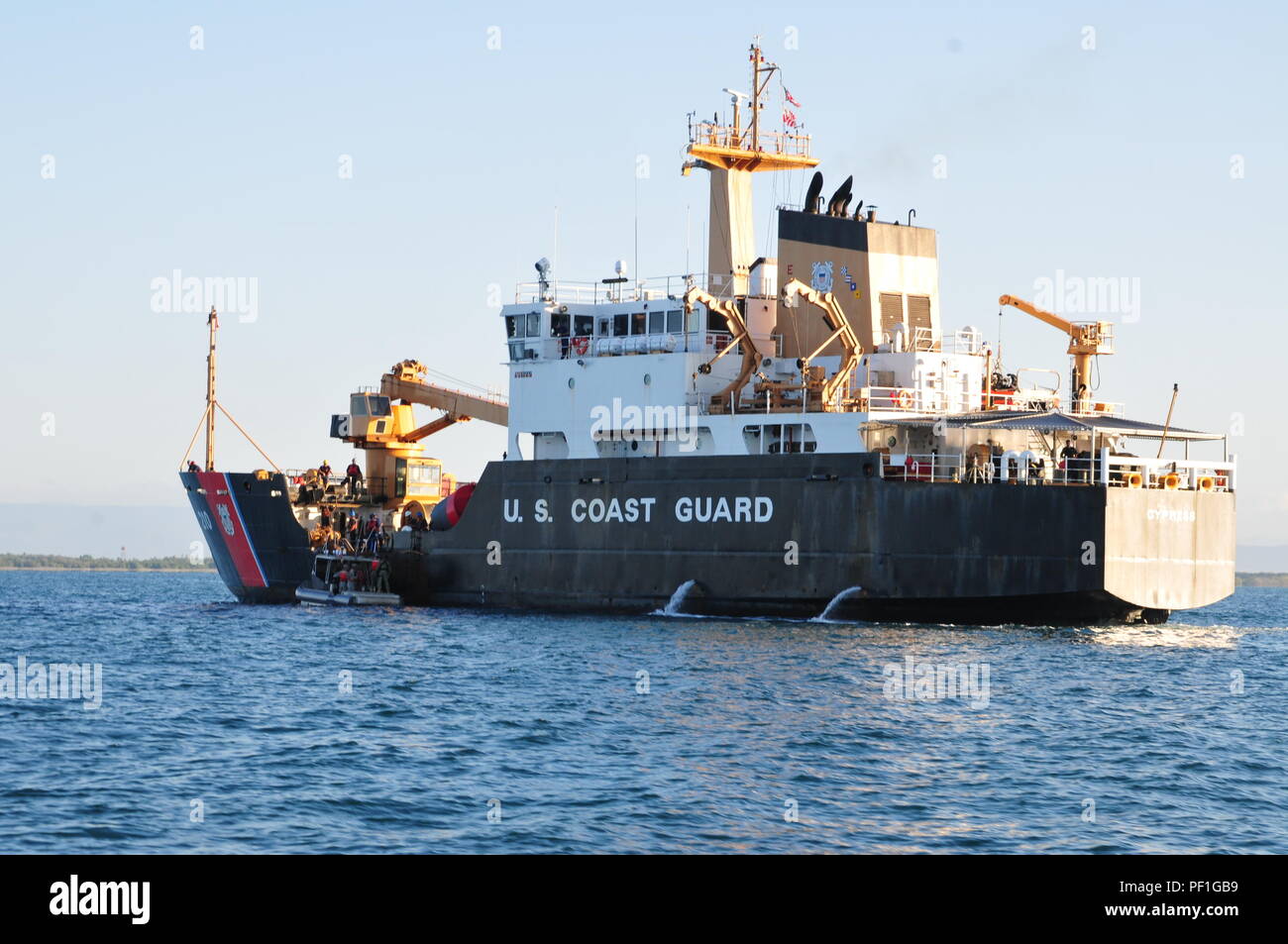 Coast Guardsmen, with Joint Task Force Guantanamo, board the U.S. Coast ...