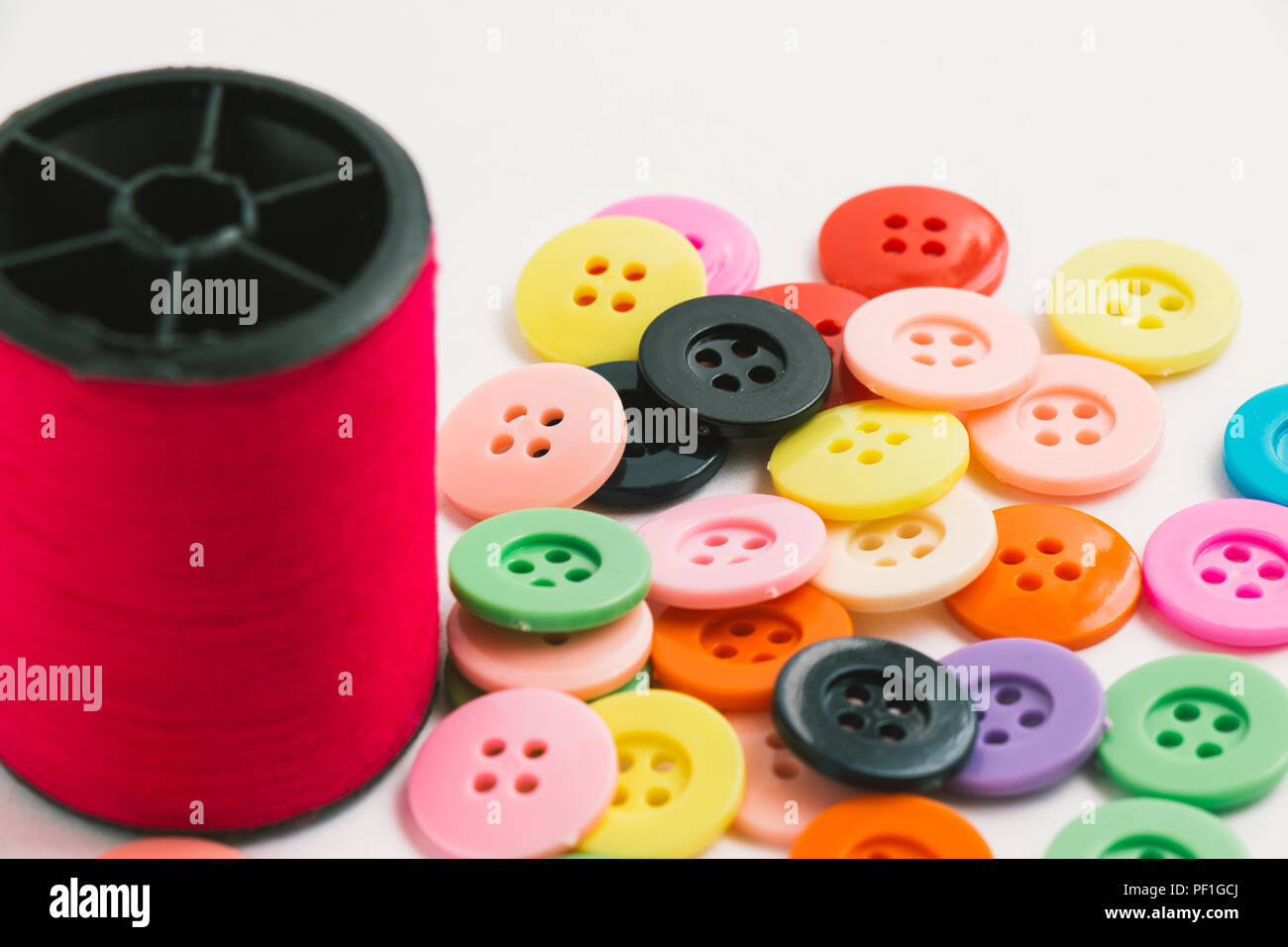 Spool of thread and buttons, sew instrument isolated on white ...